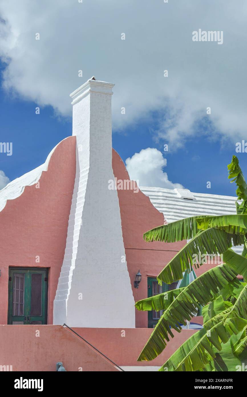 Detail of Light Coral Bermuda House with Green Shutters and White ...