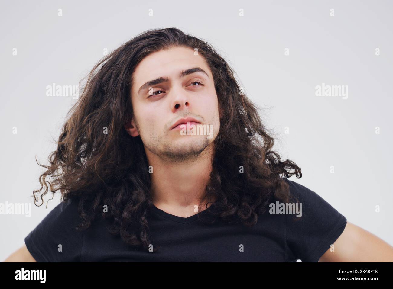 Thinking, confused and man with doubt in studio for brainstorming ...