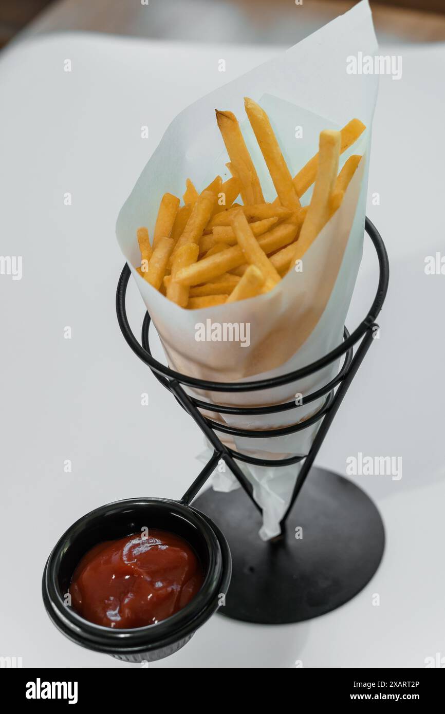 French fries with ketchup on a stand on a white background Stock Photo ...