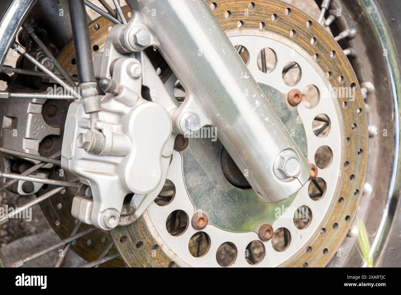 Detail of front wheel of vintage motorcycle with disc brake Stock Photo ...