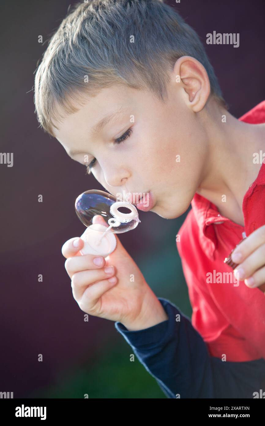 Little boy bubbles nature hi-res stock photography and images - Alamy