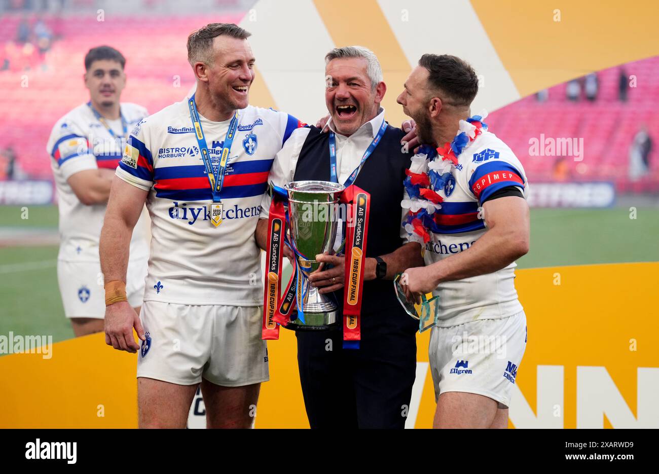 Wakefield Trinity head coach Daryl Powell (centre) with the trophy ...