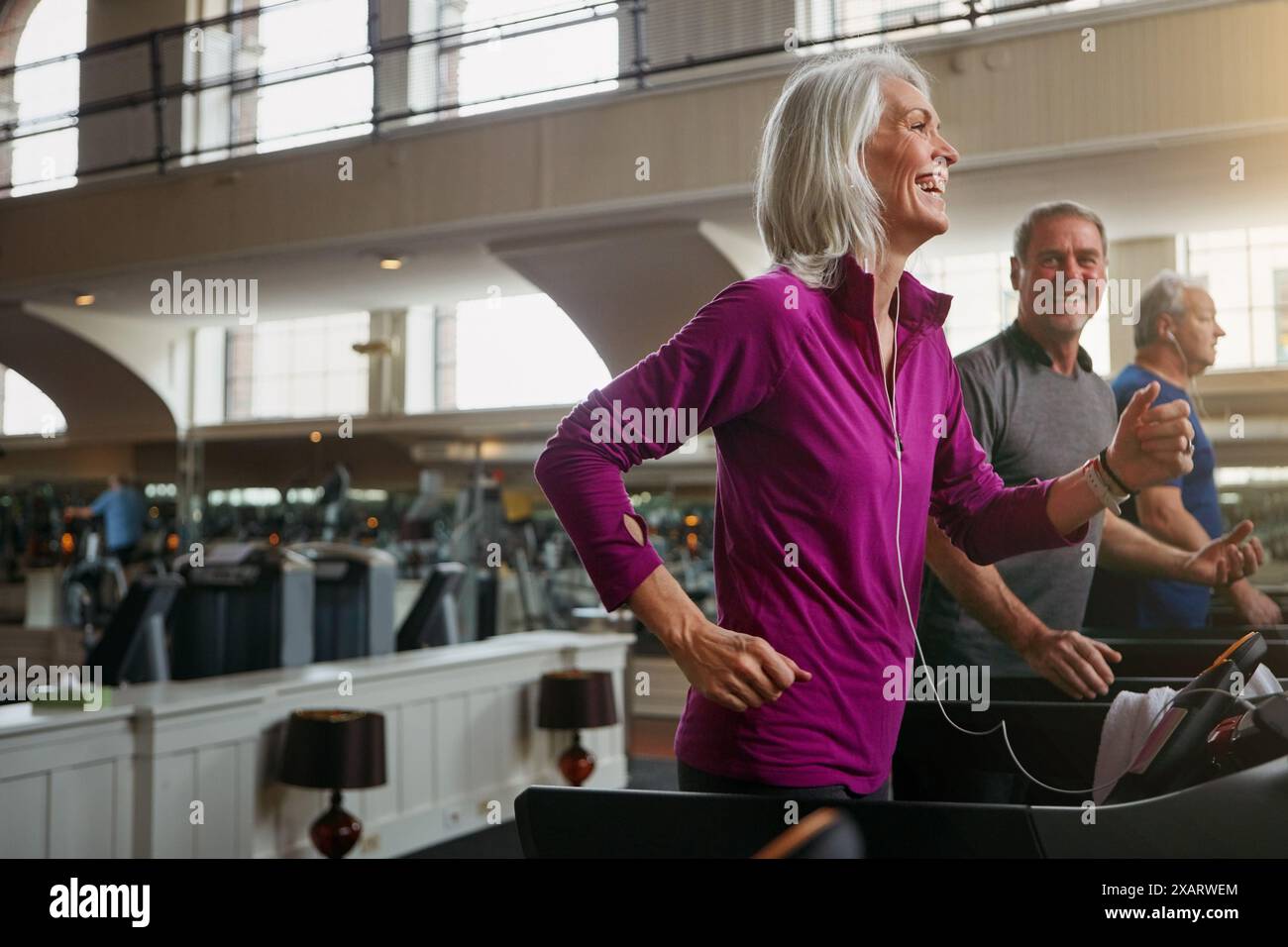 Exercise, treadmill and senior people running in gym for workout ...