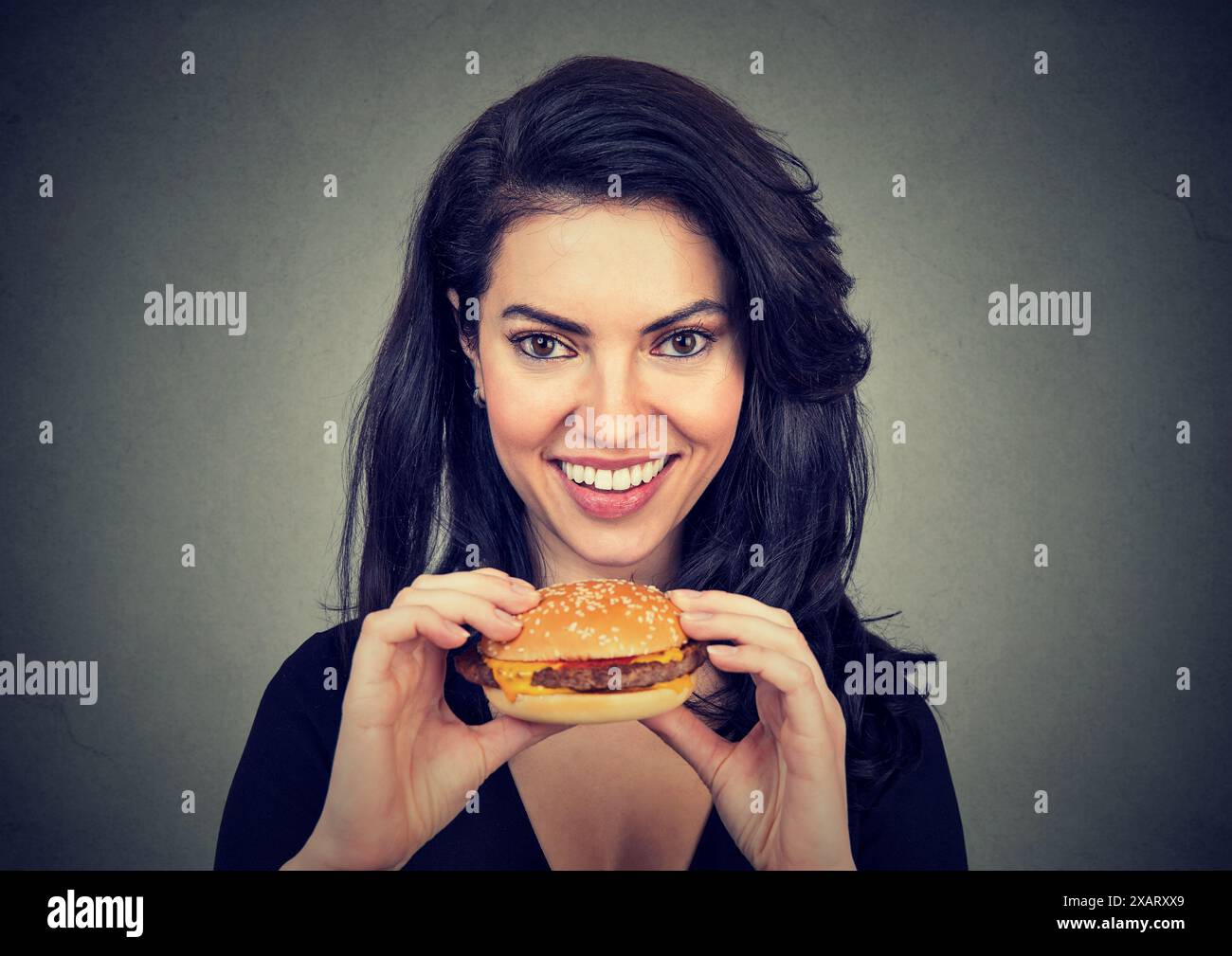 Woman eating burger smile hi-res stock photography and images - Alamy