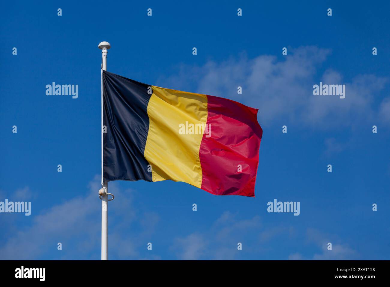 Close-up on a Belgium flag waving atop of its pole Stock Photo - Alamy