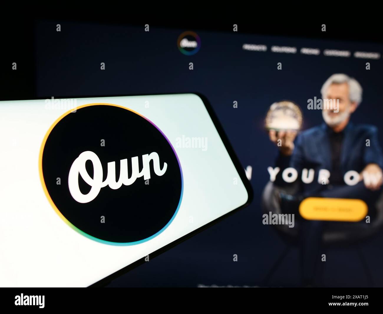 Cellphone with logo of American data platform business Own Company ...