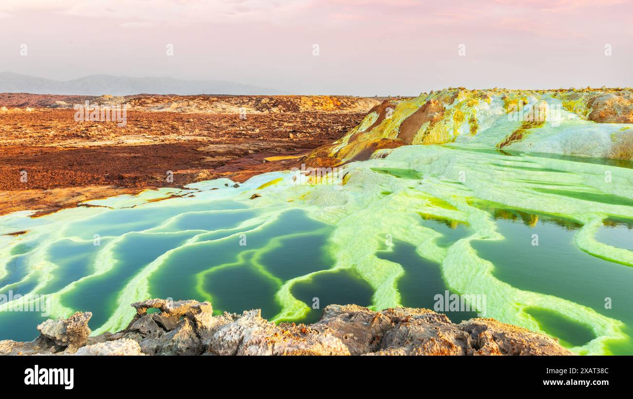 Colorful green volcanic lake terraces and yellow sulphur minerals ...