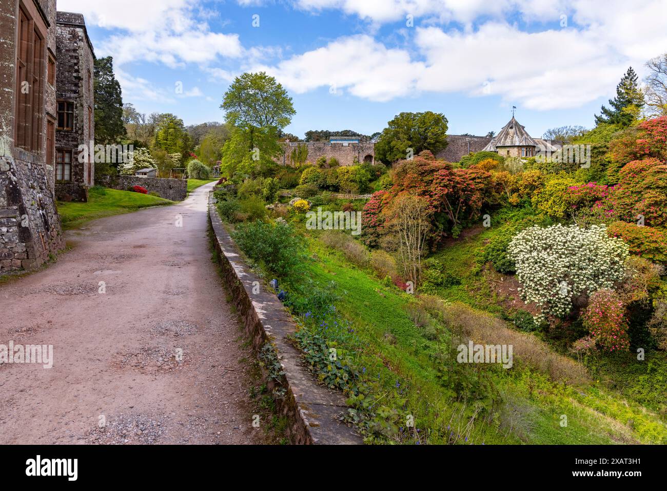 View of the gardens from Muncaster Castle, a Medieval castle, home of ...