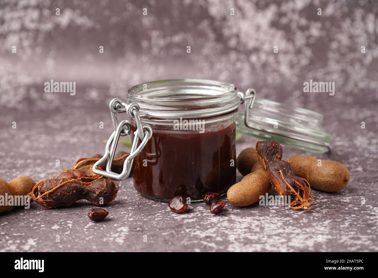 Jar with tasty tamarind jam and fruits on grey background Stock Photo ...