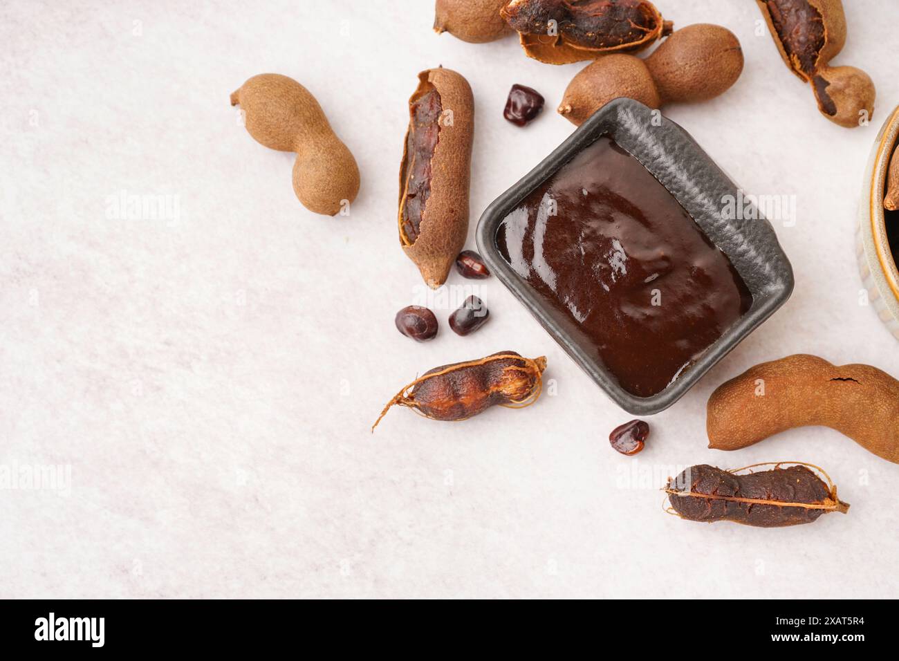 Bowl with tasty tamarind jam with fruits on white background Stock ...
