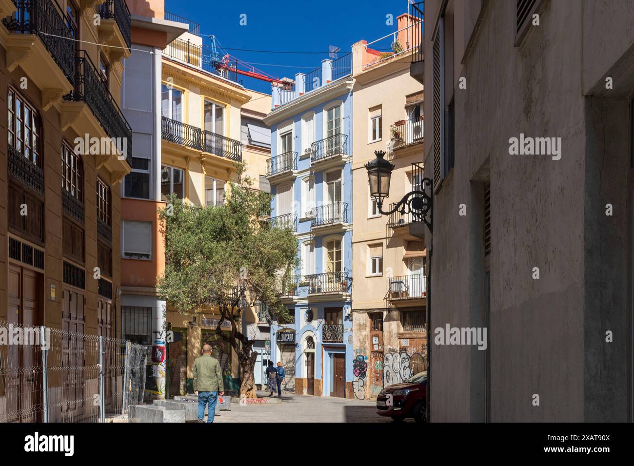 VALENCIA, SPAIN - May 2, 2024: Narrow streets with colorful houses in ...