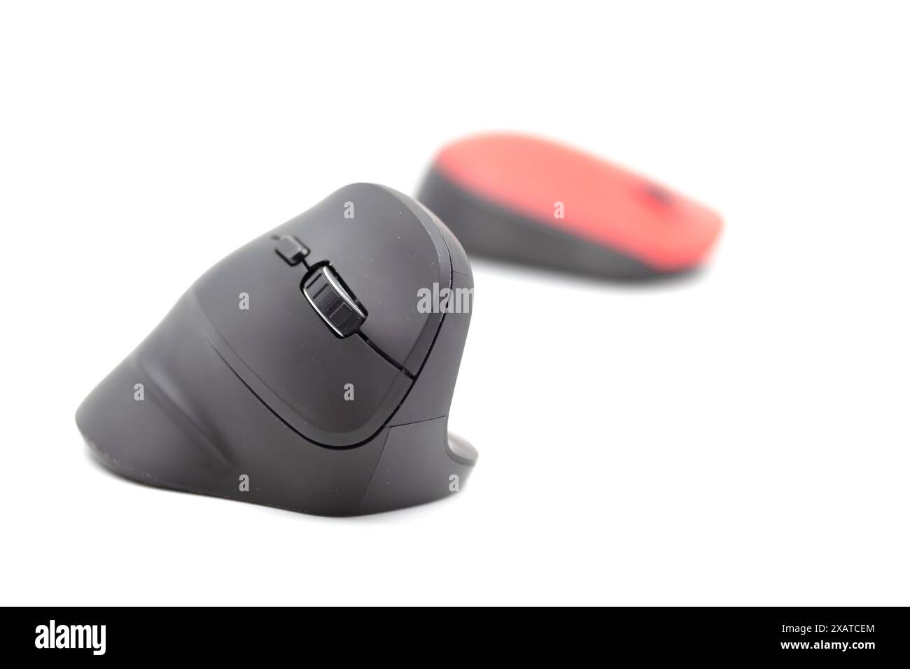 Vertical black and horizontal red computer mouse on a white background ...