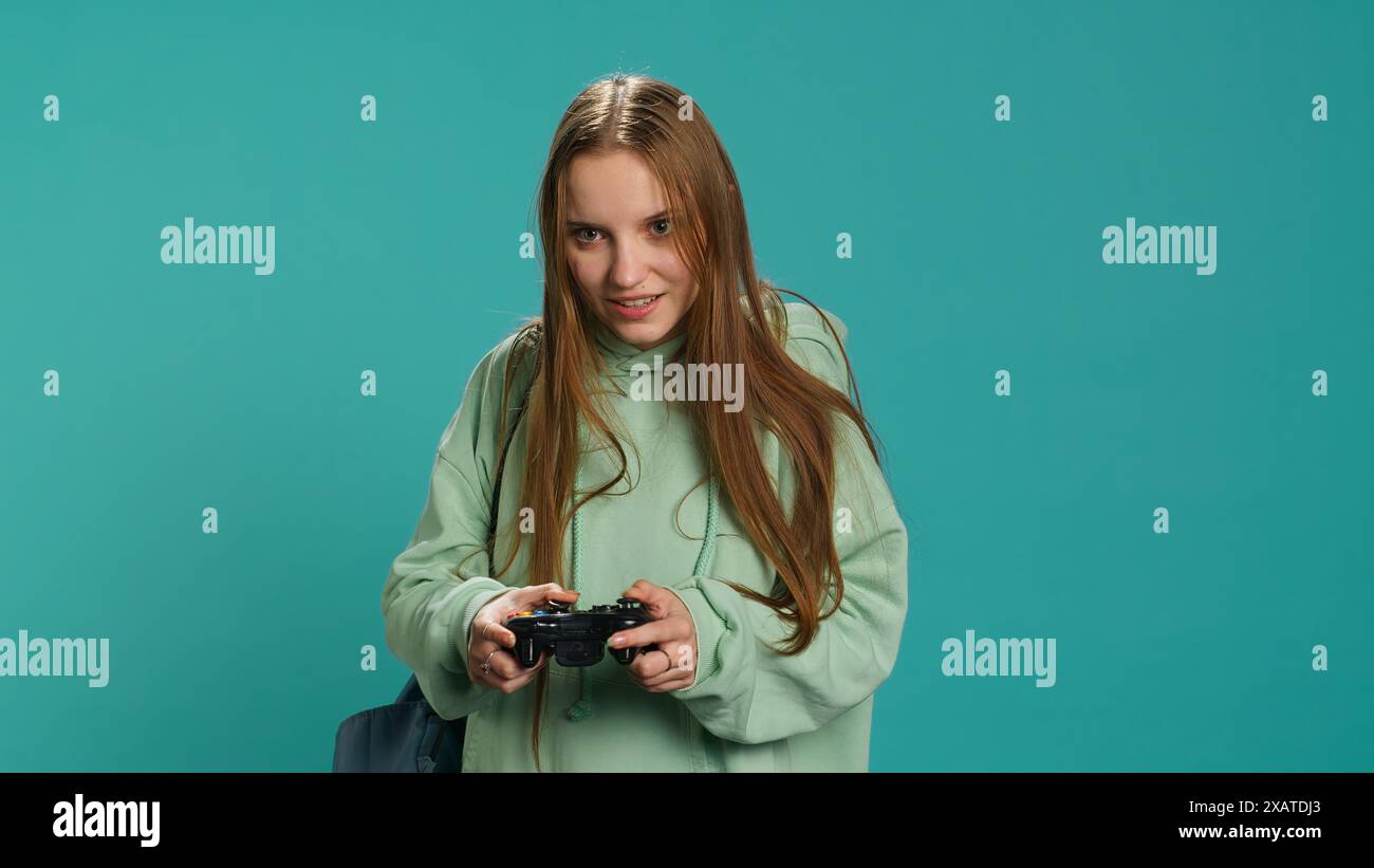 Euphoric woman playing intense gaming console game, celebrating win ...