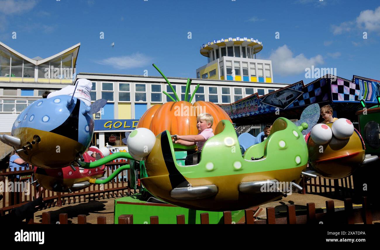 ENGLISH COASTAL PATH, CHILDREN ON THE RIDES AT,CLARENCE PIER AMUSEMENT ...