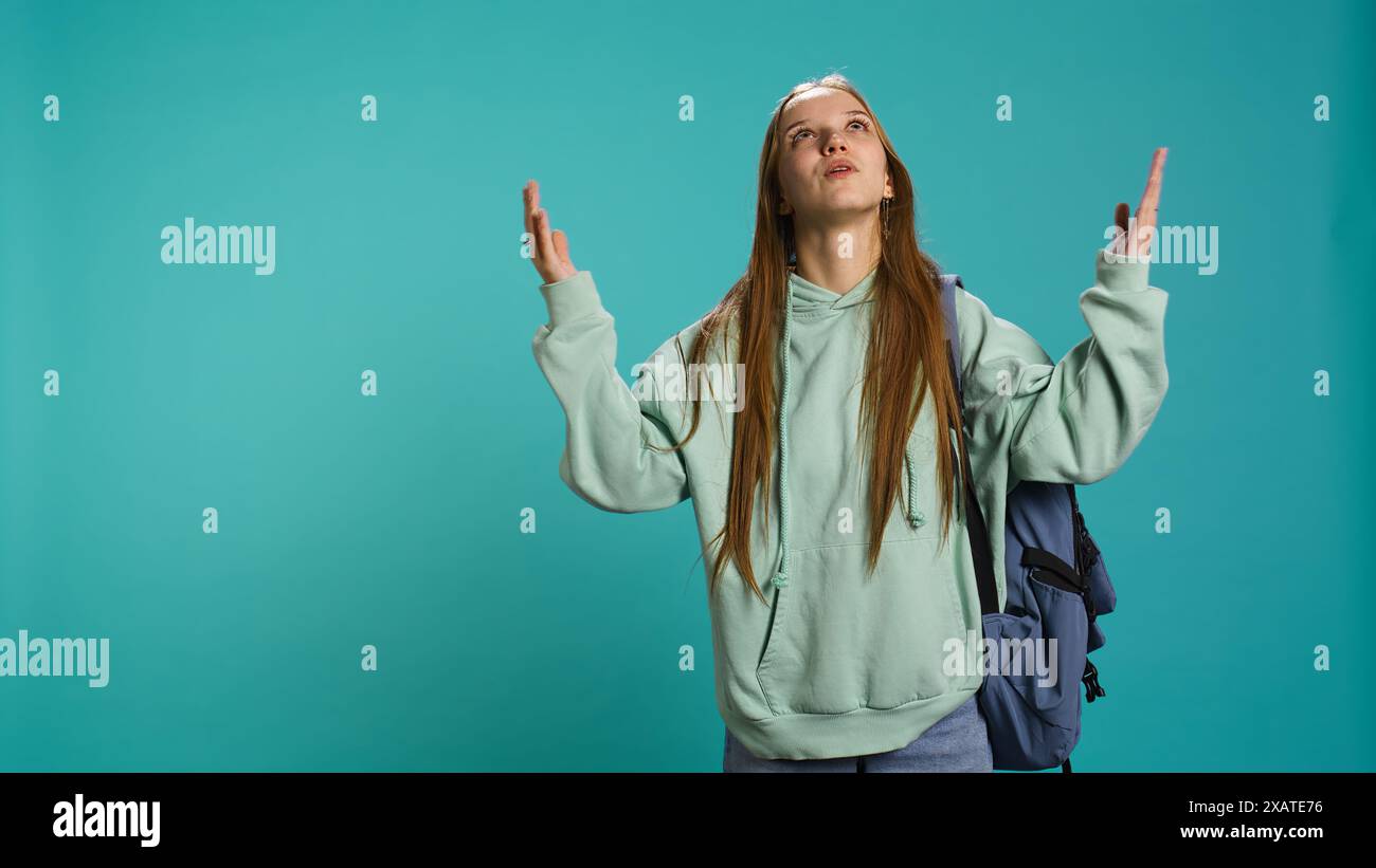 Pious woman looking up towards sky, waiting for sign from god ...