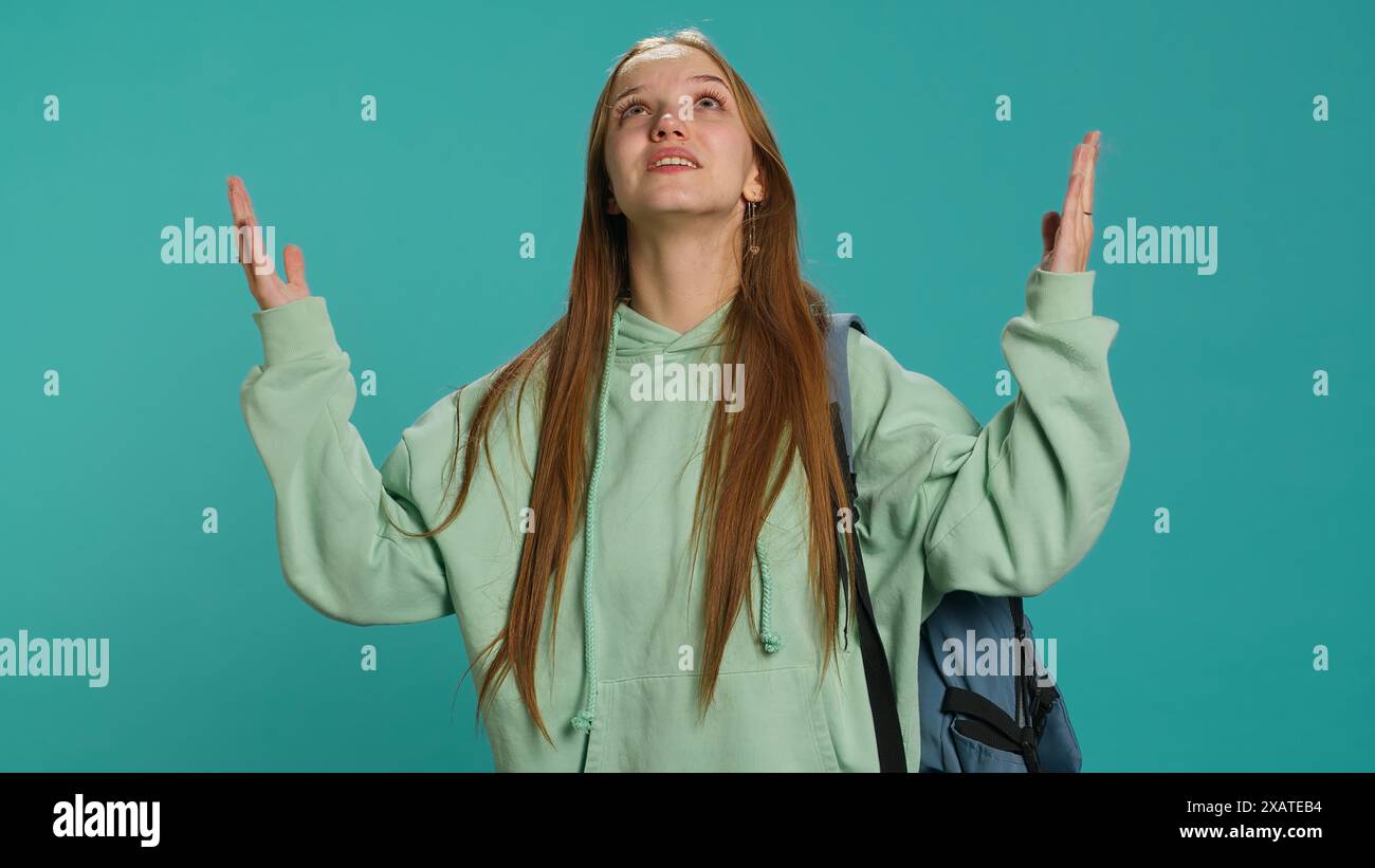 Pious woman looking up towards sky, waiting for sign from god ...