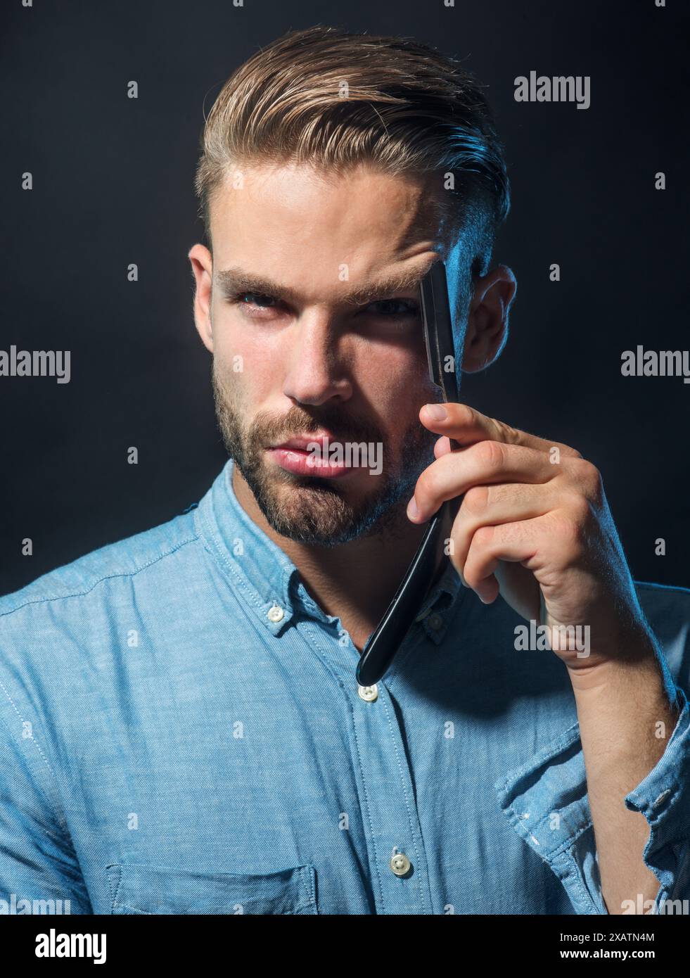 Bearded man shave with straight razor. Professional barber with ...