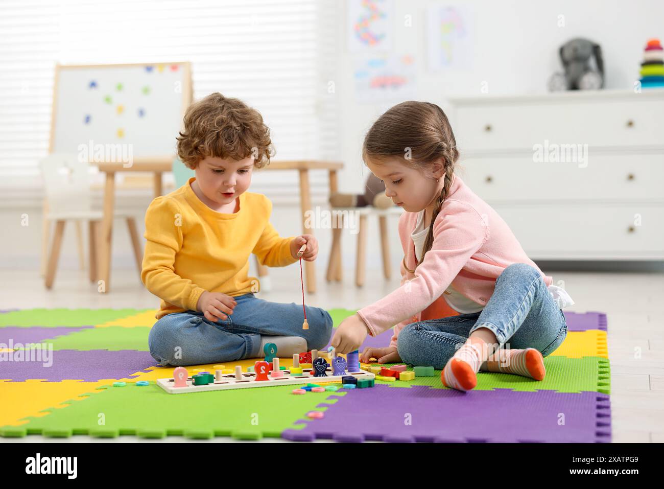 Cute little children playing with math game Fishing for Numbers on ...