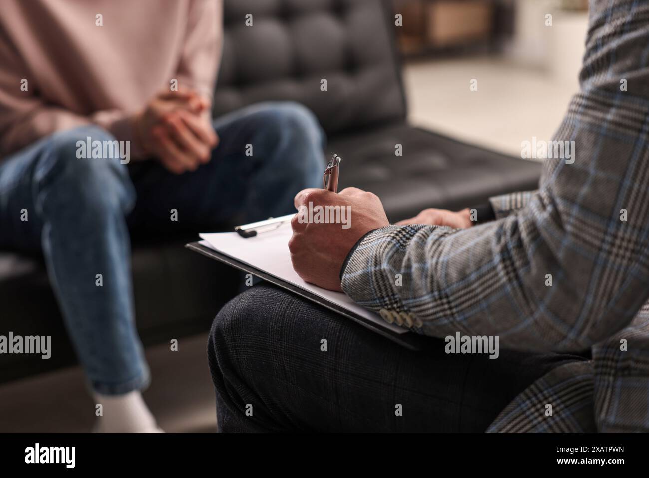 Professional psychotherapist working with patient in office, closeup ...