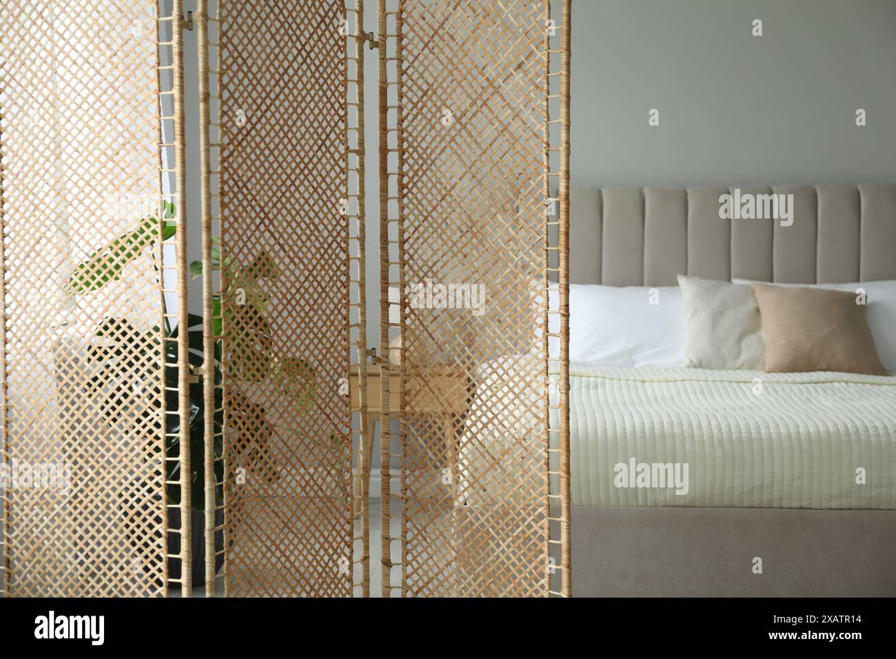 Folding screen and comfortable bed in bedroom. Interior design Stock ...