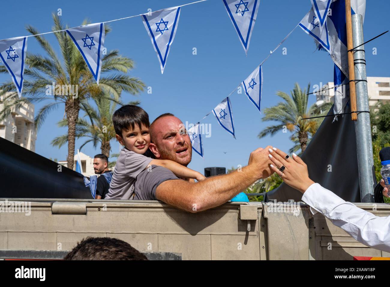 A man and a boy in the streets celebrations following the announcement ...