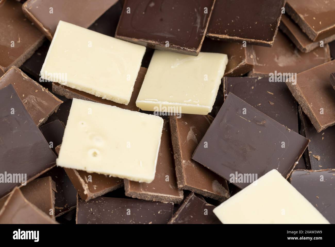 dark, milk and white chocolate pieces mixed with different types of ...