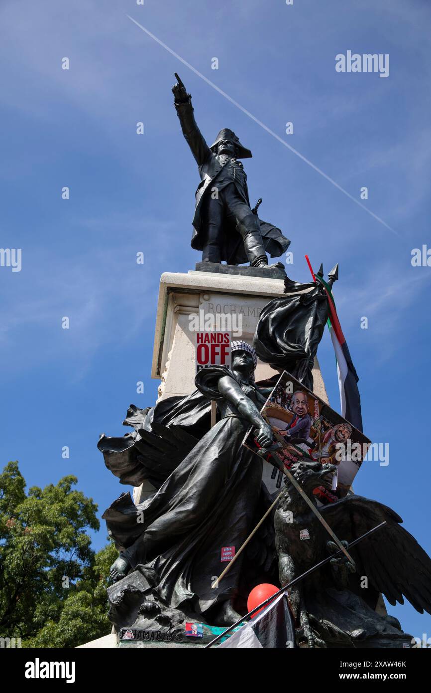 People climb onto a statue in Lafayette Park and put banners and ...