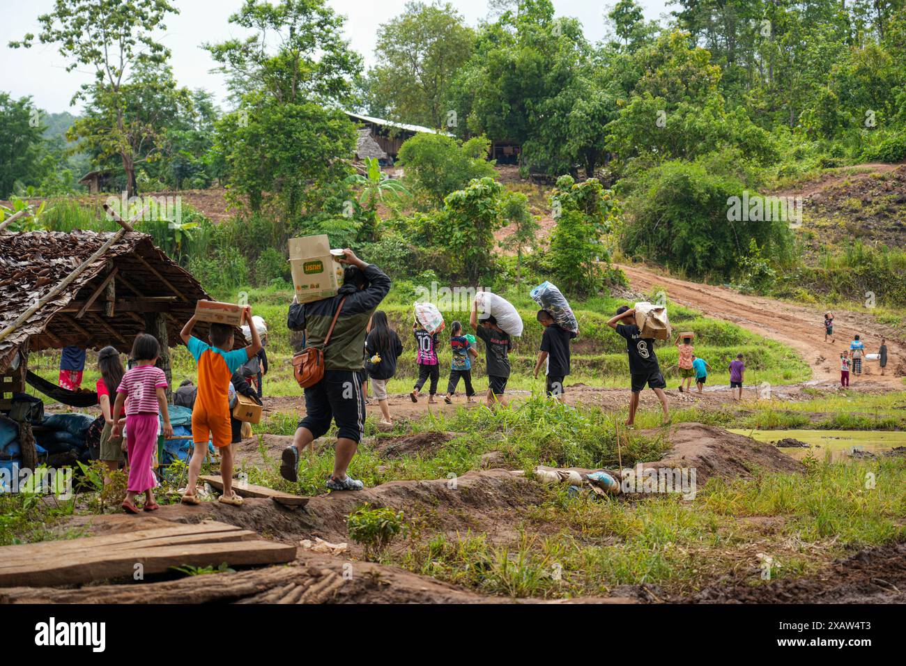 The member of the Southern Territory Supportive Organization is seen carrying the loads to the ...
