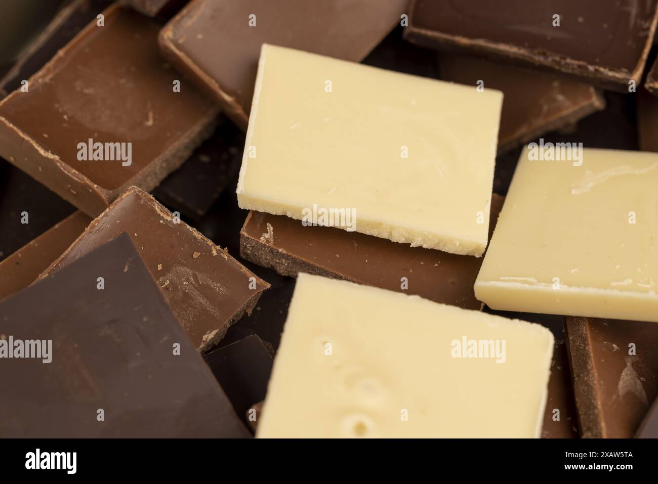 dark, milk and white chocolate pieces mixed with different types of ...
