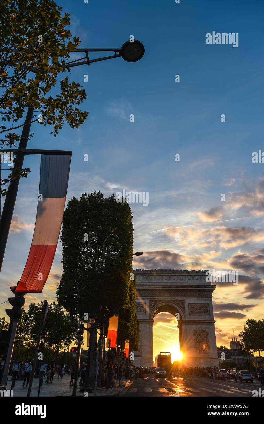 Beautiful Sunset behind Arc de Triomphe on Champs-Élysées, with French ...
