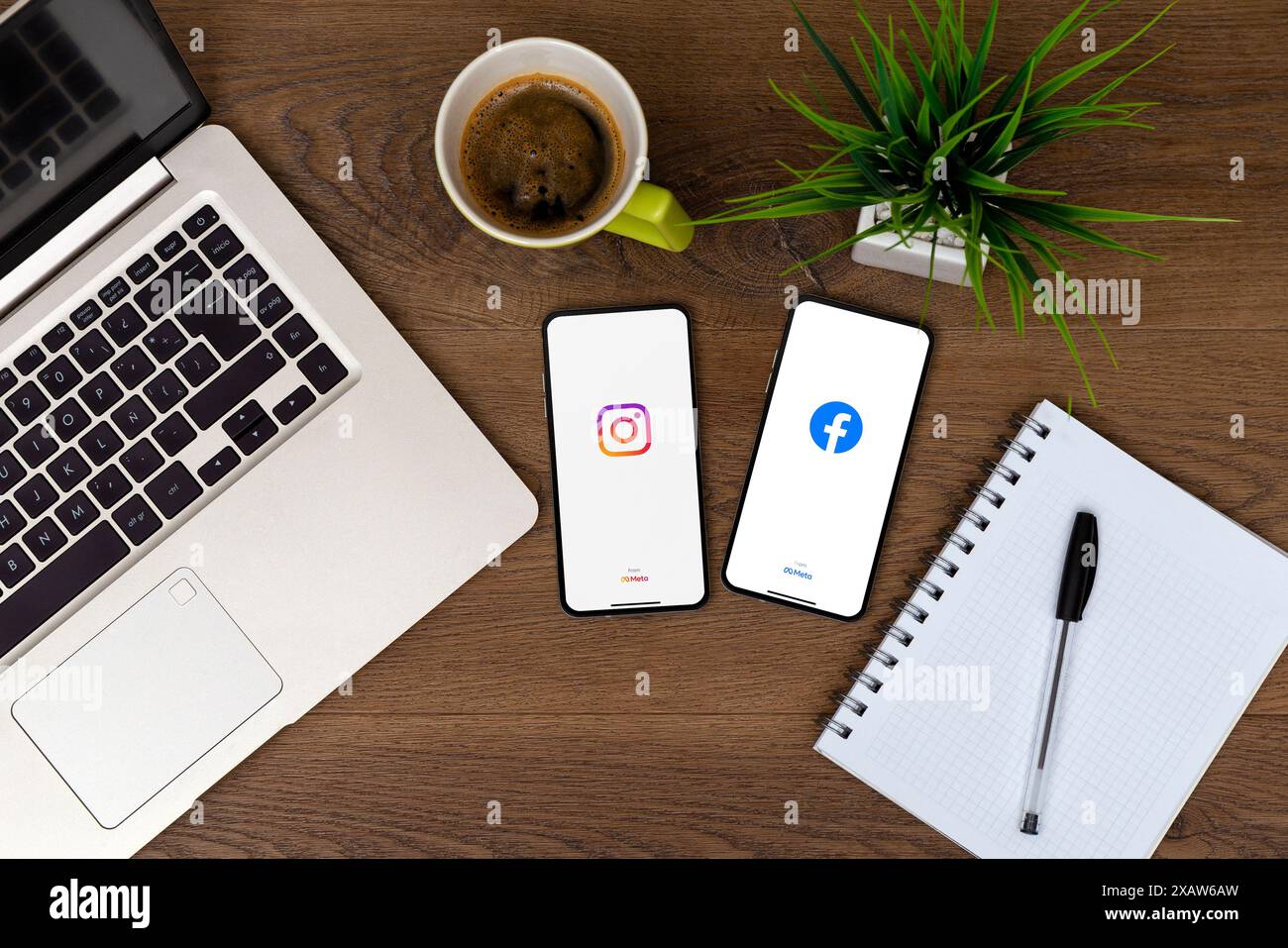 Facebook and instagram app on two mobile phones screen over a desk. Top ...