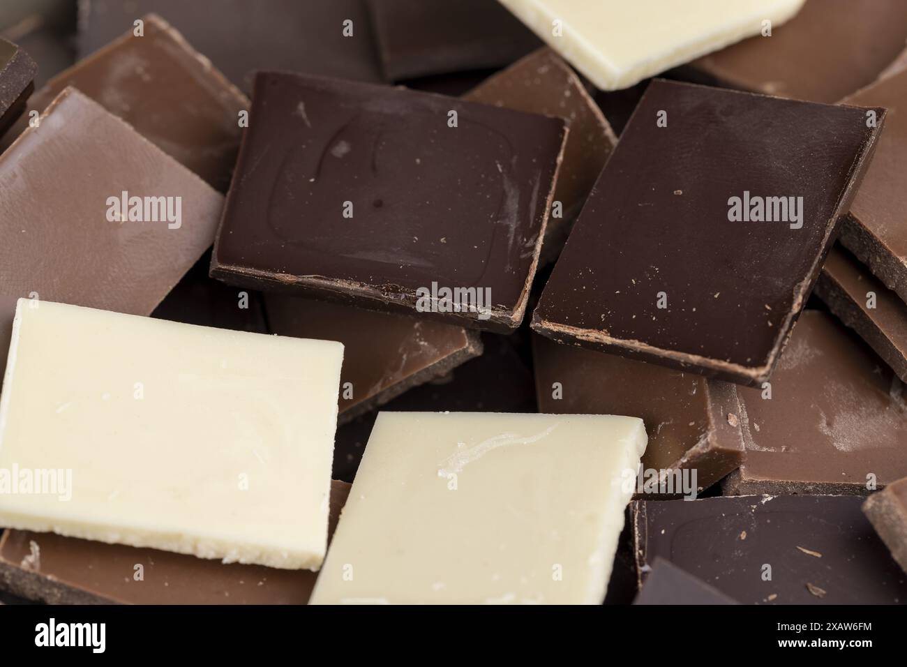 dark, milk and white chocolate pieces mixed with different types of ...