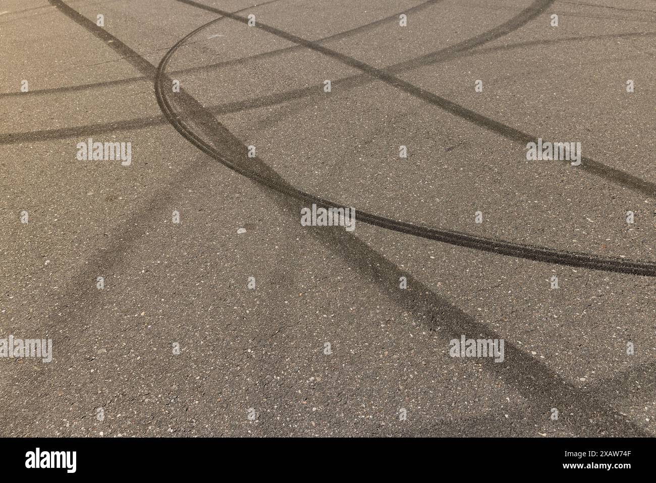 tire tracks during dangerous driving on the road , wheel streaks from ...
