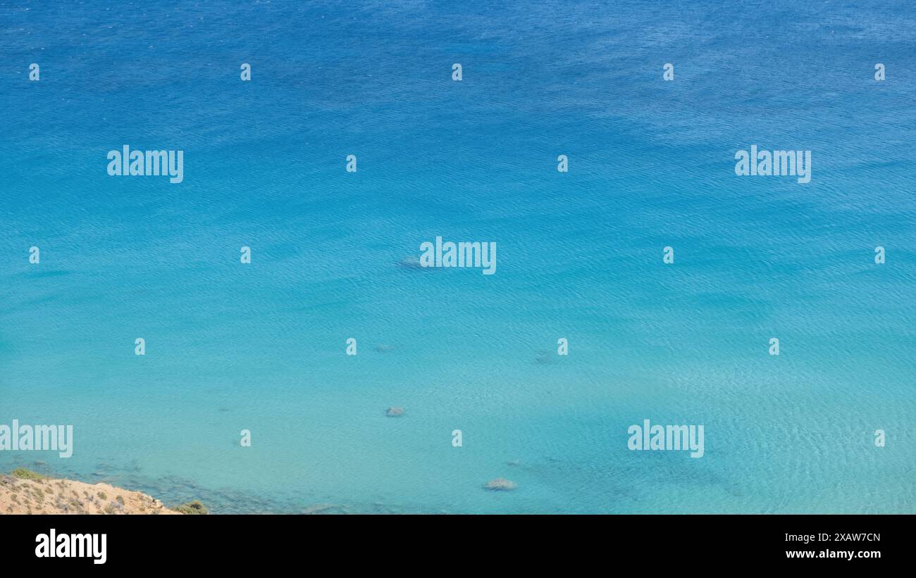 Ripple sea water, above view of sandy bottom with few pebble background ...