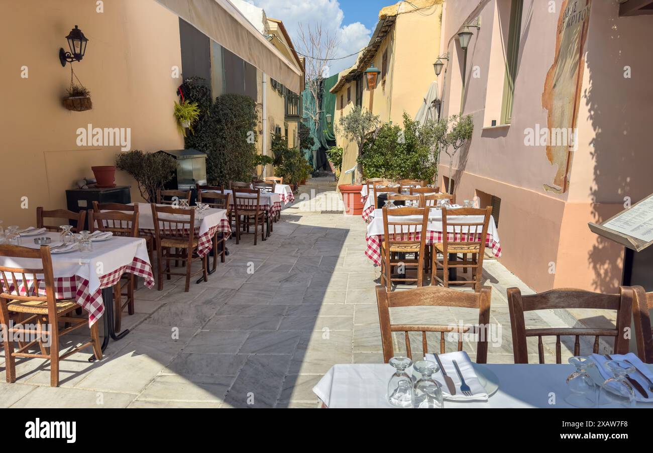Athens, Greece. Greek traditional open-air tavern empty table and chair ...