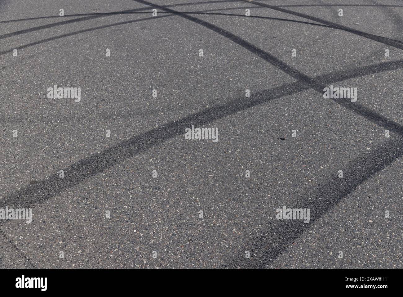 tire tracks during dangerous driving on the road , wheel streaks from ...