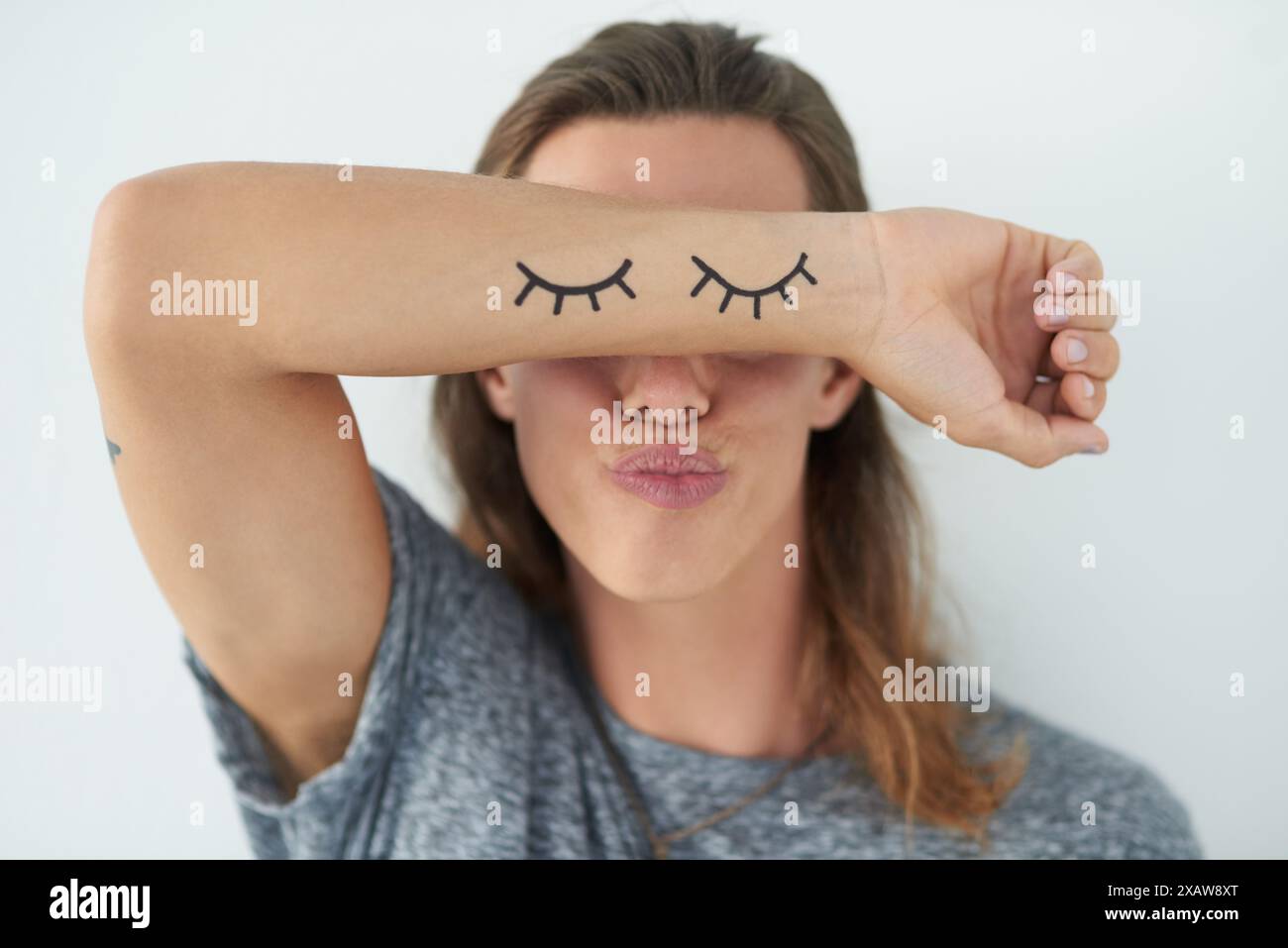 Person, expression and arm covering eyes with shy, eyelash and emoji ...