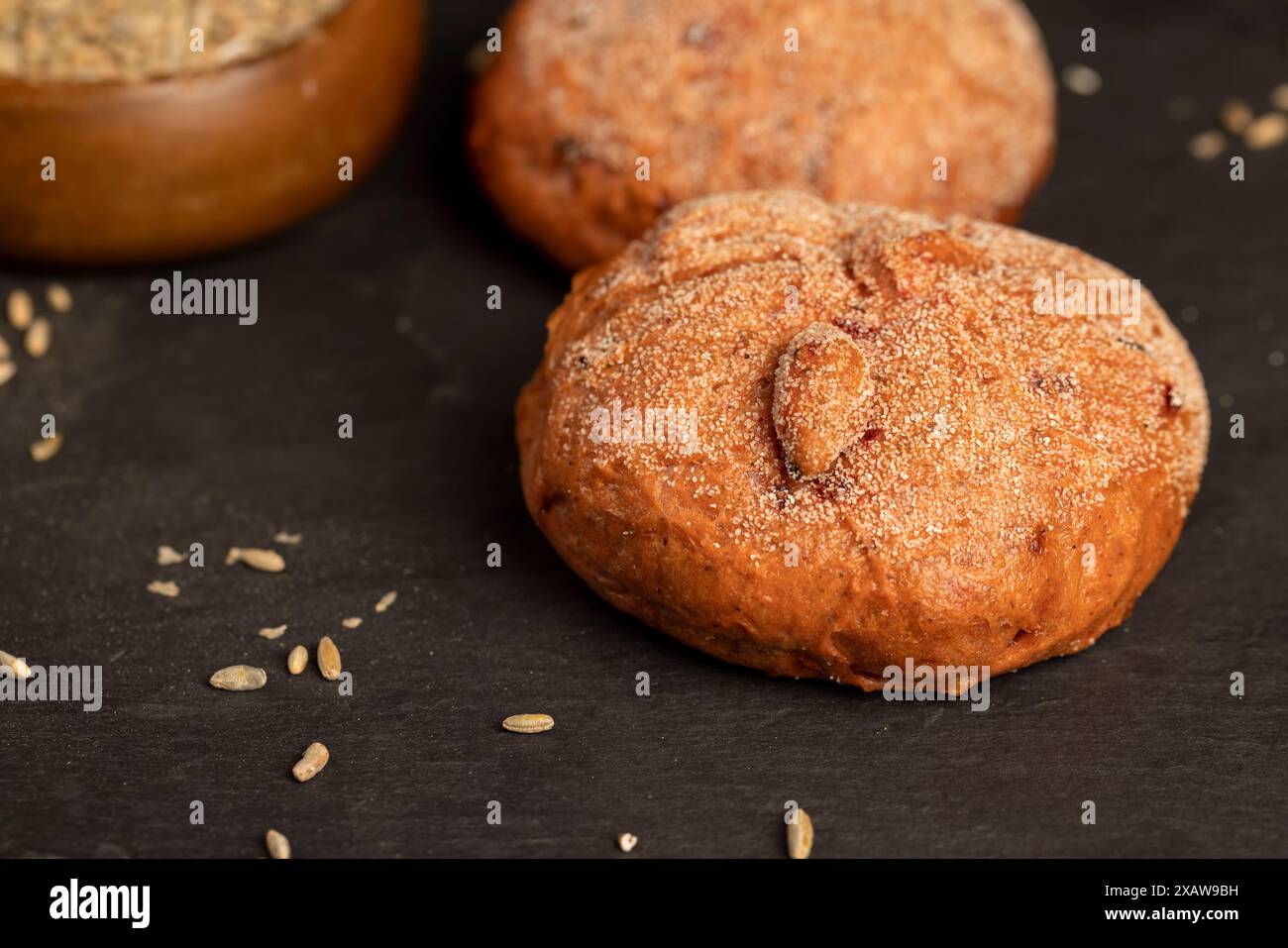 a fresh red round bun on the table, a red bun with the addition of red ...