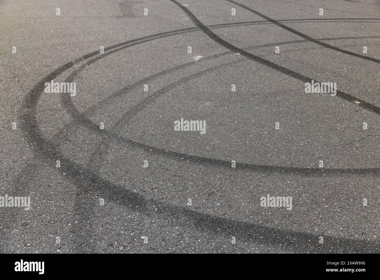 tire tracks during dangerous driving on the road , wheel streaks from ...