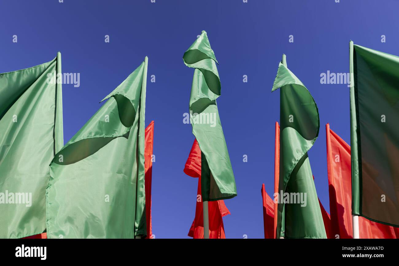 green flags set up during the celebration in windy weather, flags ...