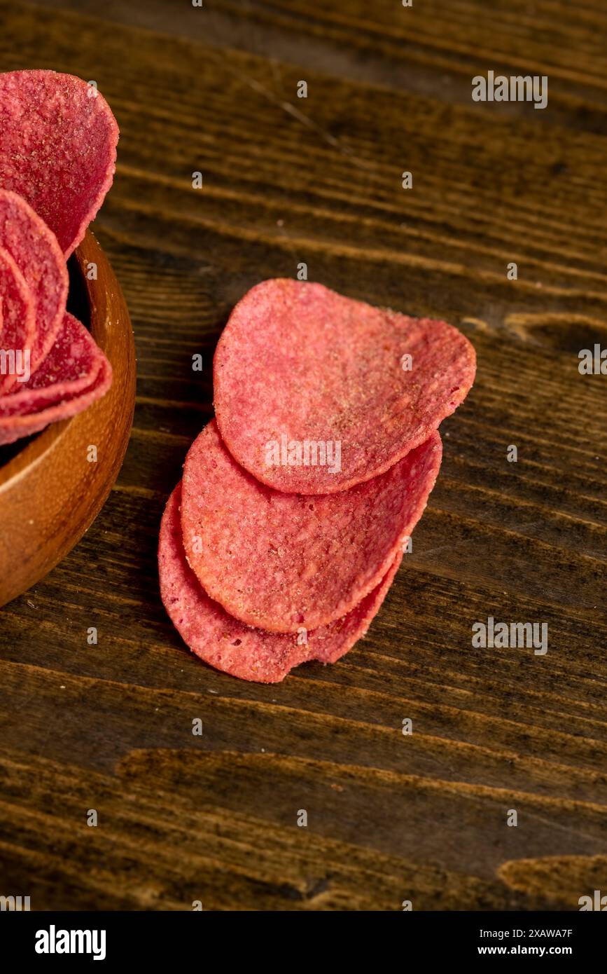 red potato chips with meat flavor, adding red dye to potato chips Stock ...