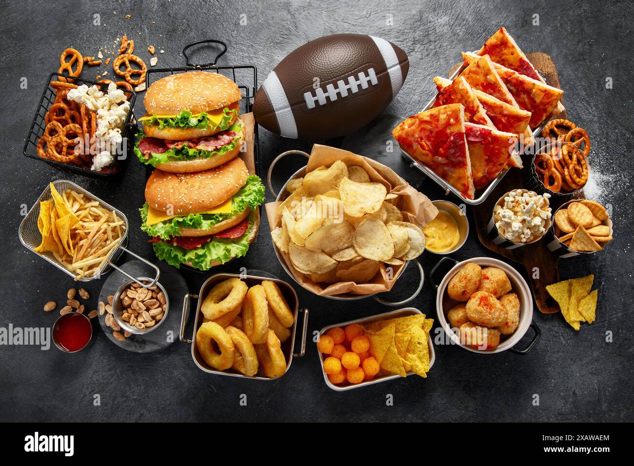 Selection of party food for watching football championship on a dark ...