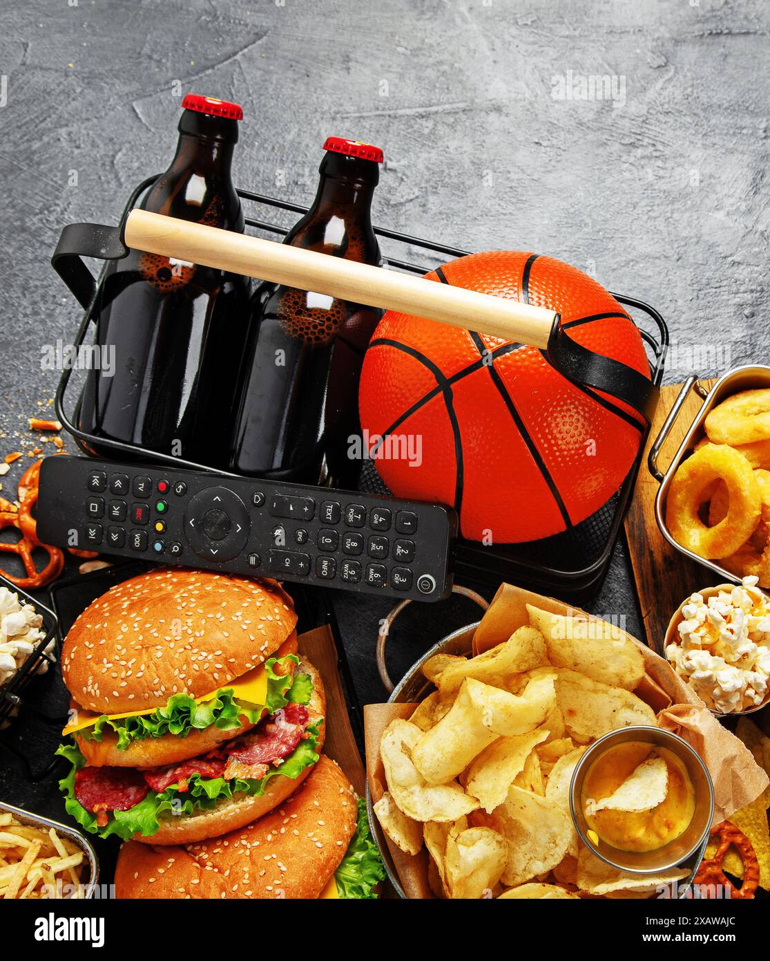 Selection of party food for watching football championship on a dark ...