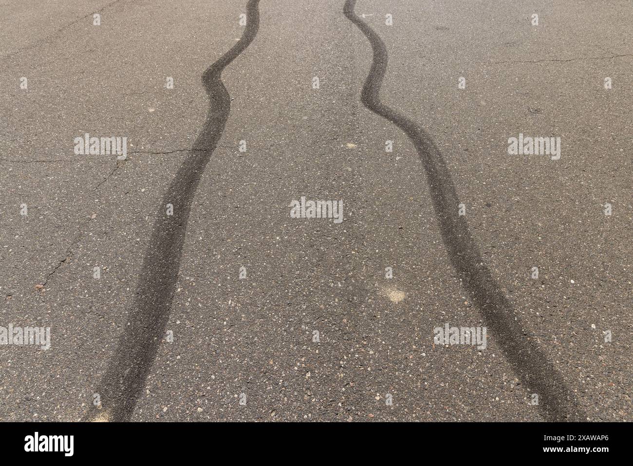 tire tracks during dangerous driving on the road , wheel streaks from ...
