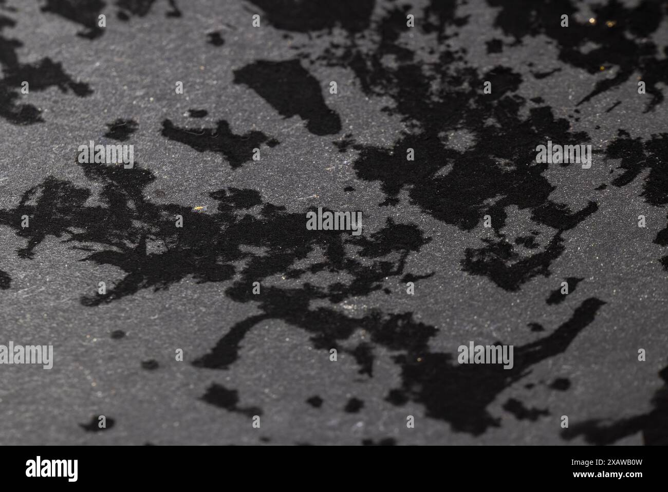 black wet slate close-up, black slate surface for serving in drops of ...