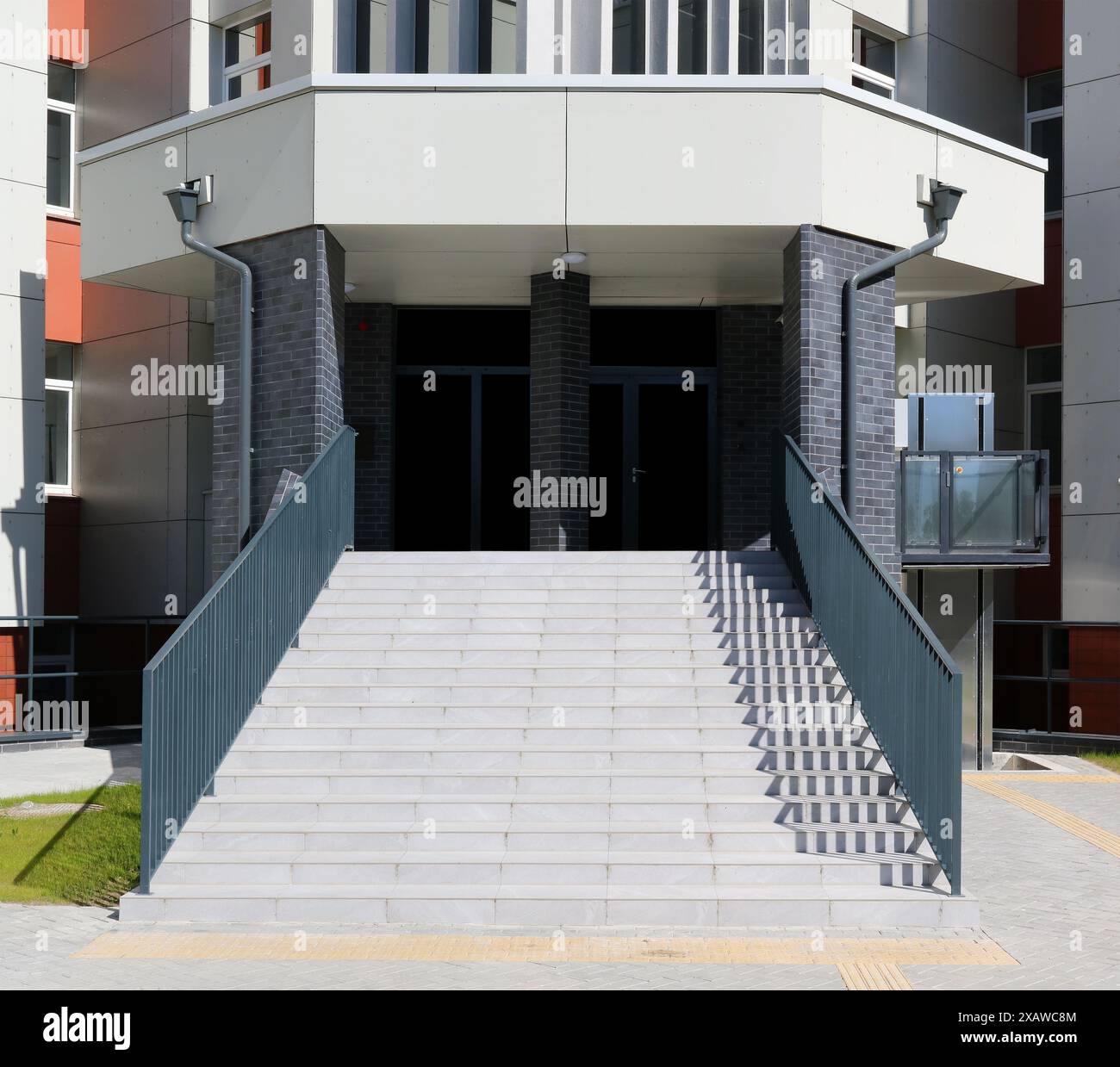 Grand staircase and lift for the disabled in an office building Stock ...