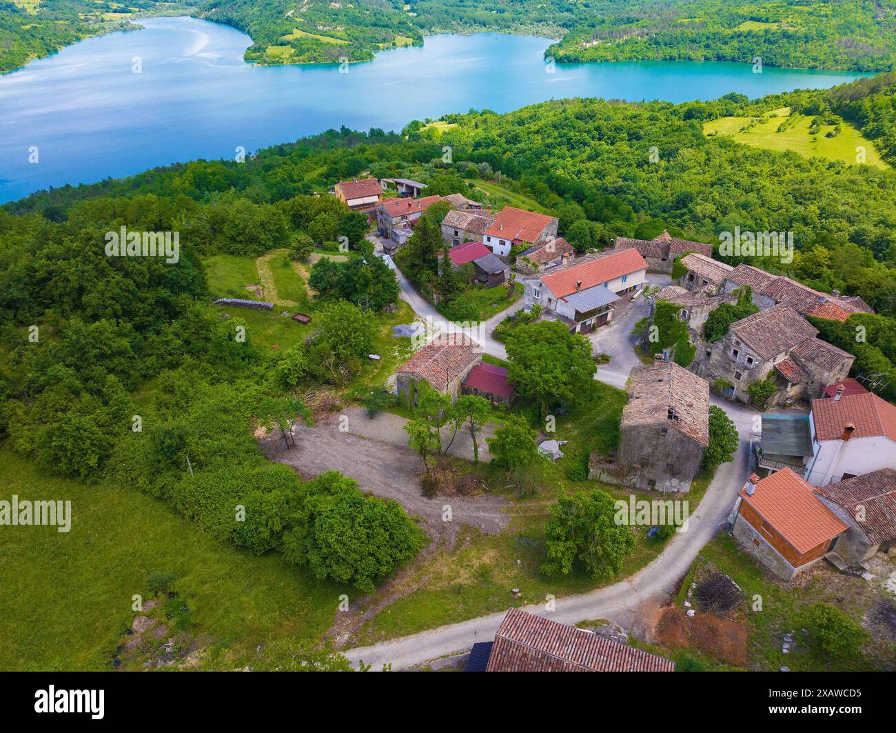 Aerial view of an old village in front og Butoniga Lake, central Istra ...