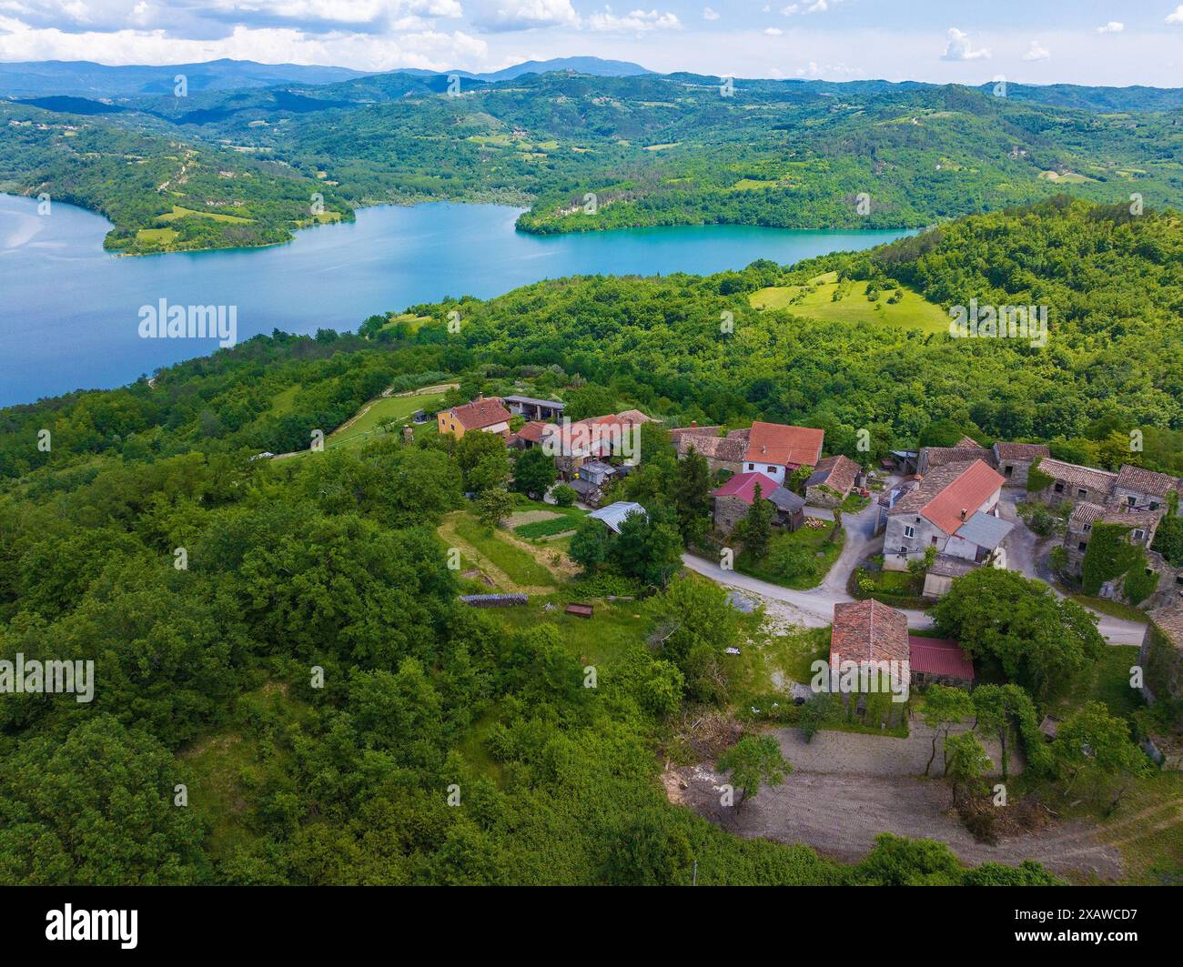 Aerial view of an old village in front og Butoniga Lake, central Istra ...