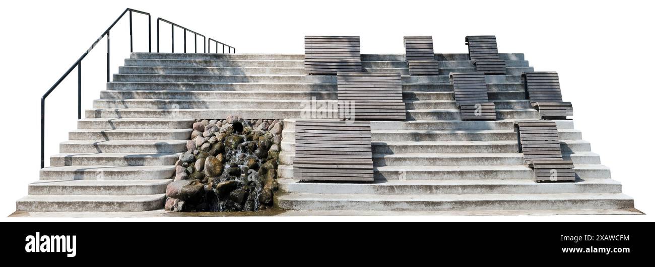 Relaxation area in the park with stairs, benches and a small stream ...