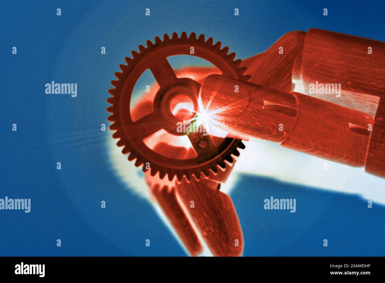 Robot hand holds a glowing gear representing tech fusion and progress ...